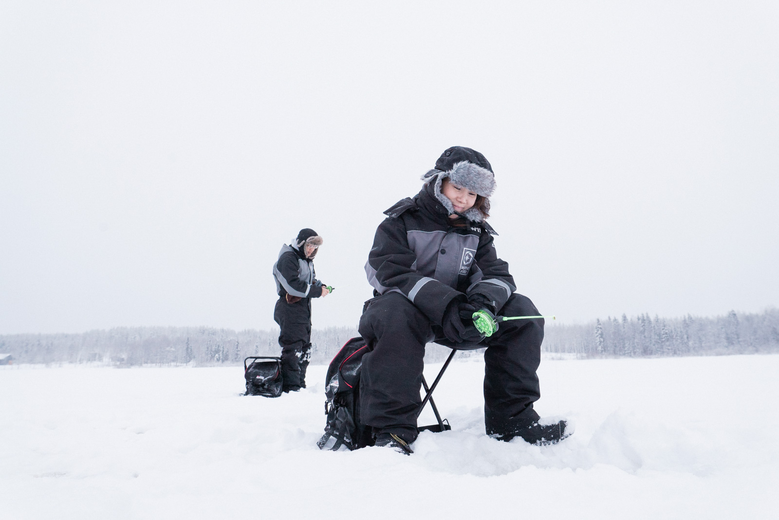 Ice Fishing on a Frozen Lake